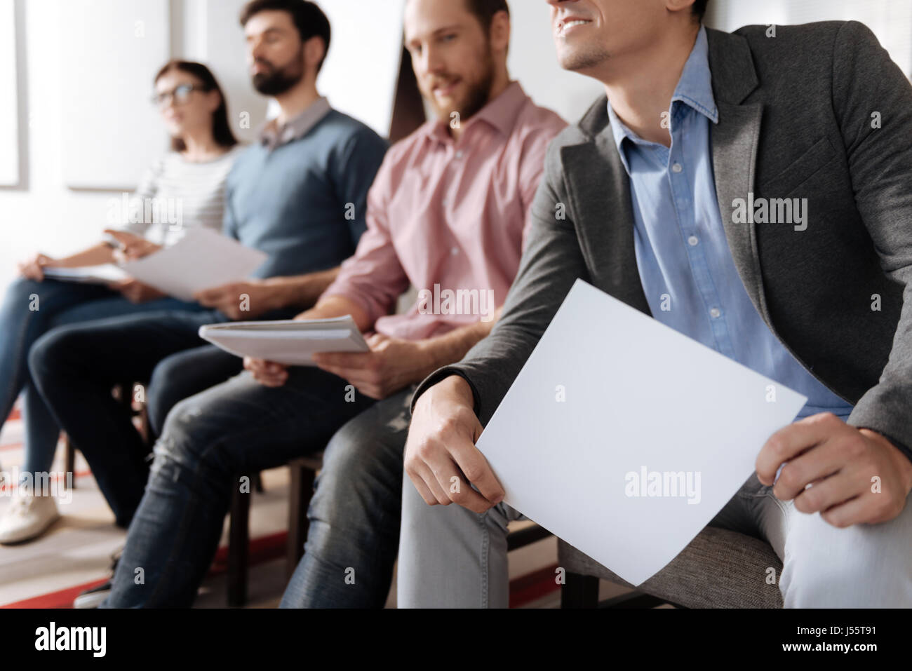 Side view of line with office workers Stock Photo - Alamy