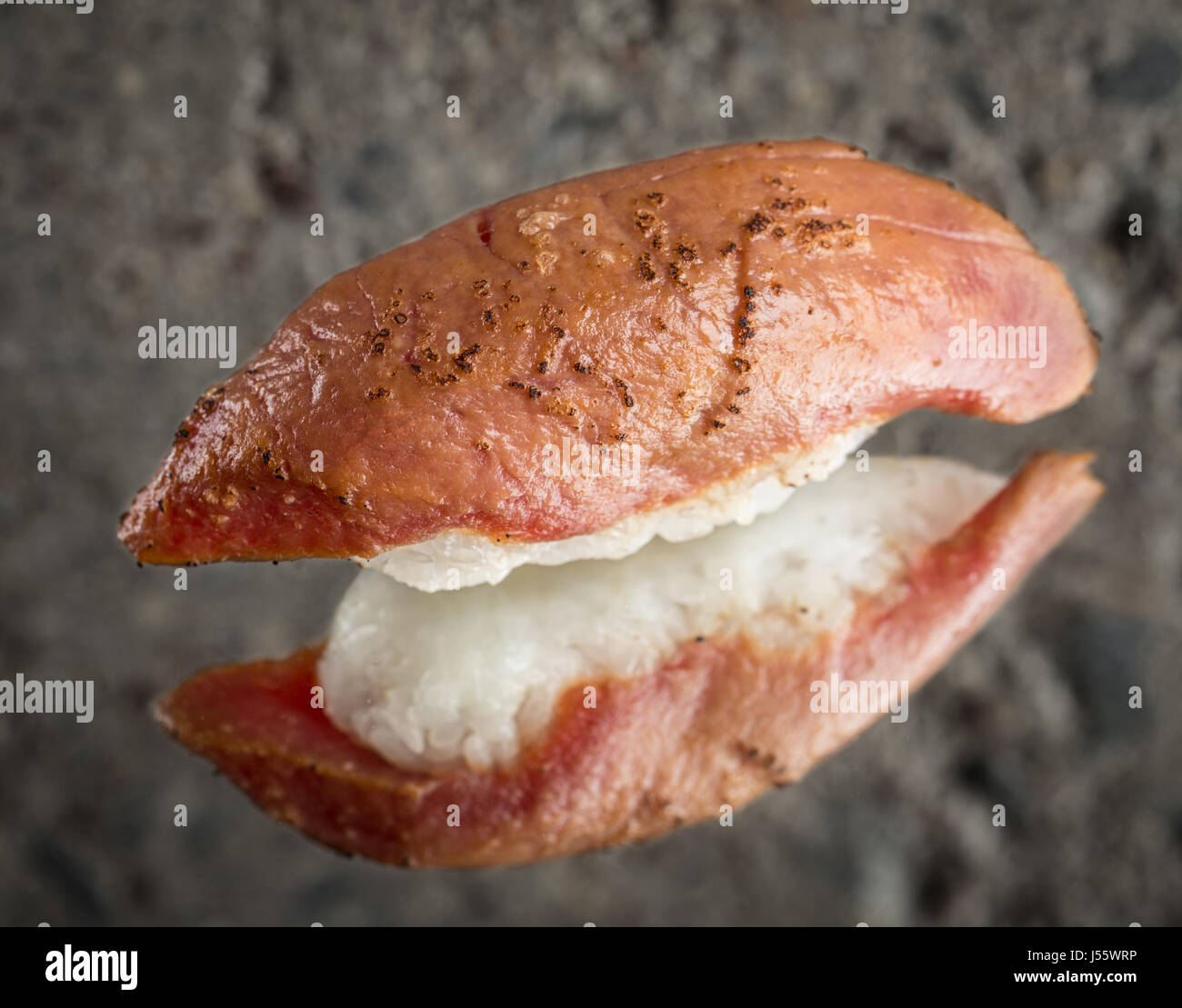 Burned nigiri sushi with tuna Stock Photo - Alamy
