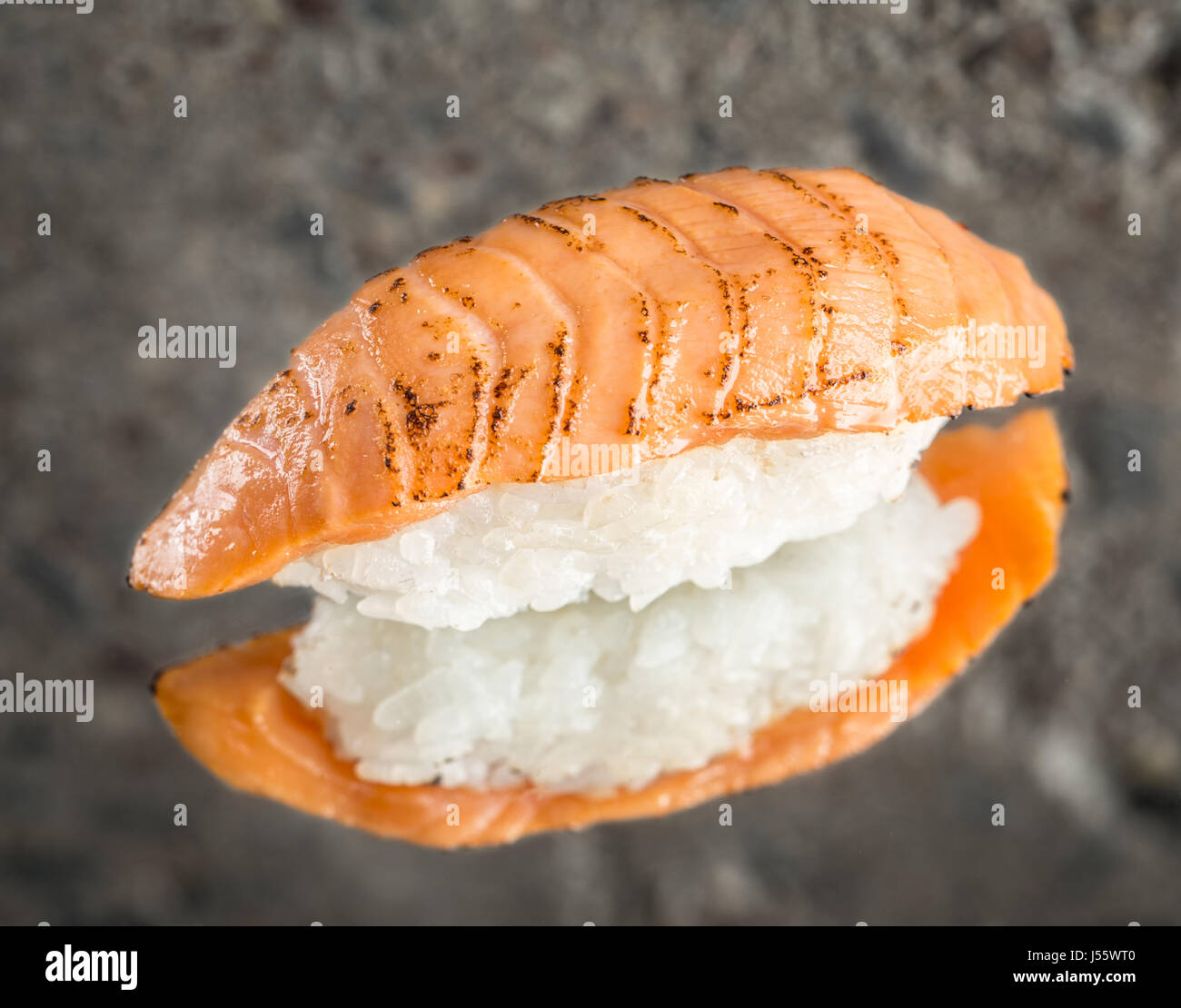 Burned nigiri sushi with salmon Stock Photo - Alamy