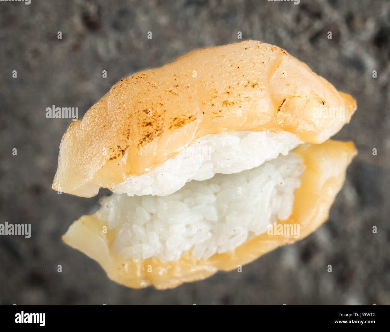 Burned nigiri sushi with scallop Stock Photo - Alamy
