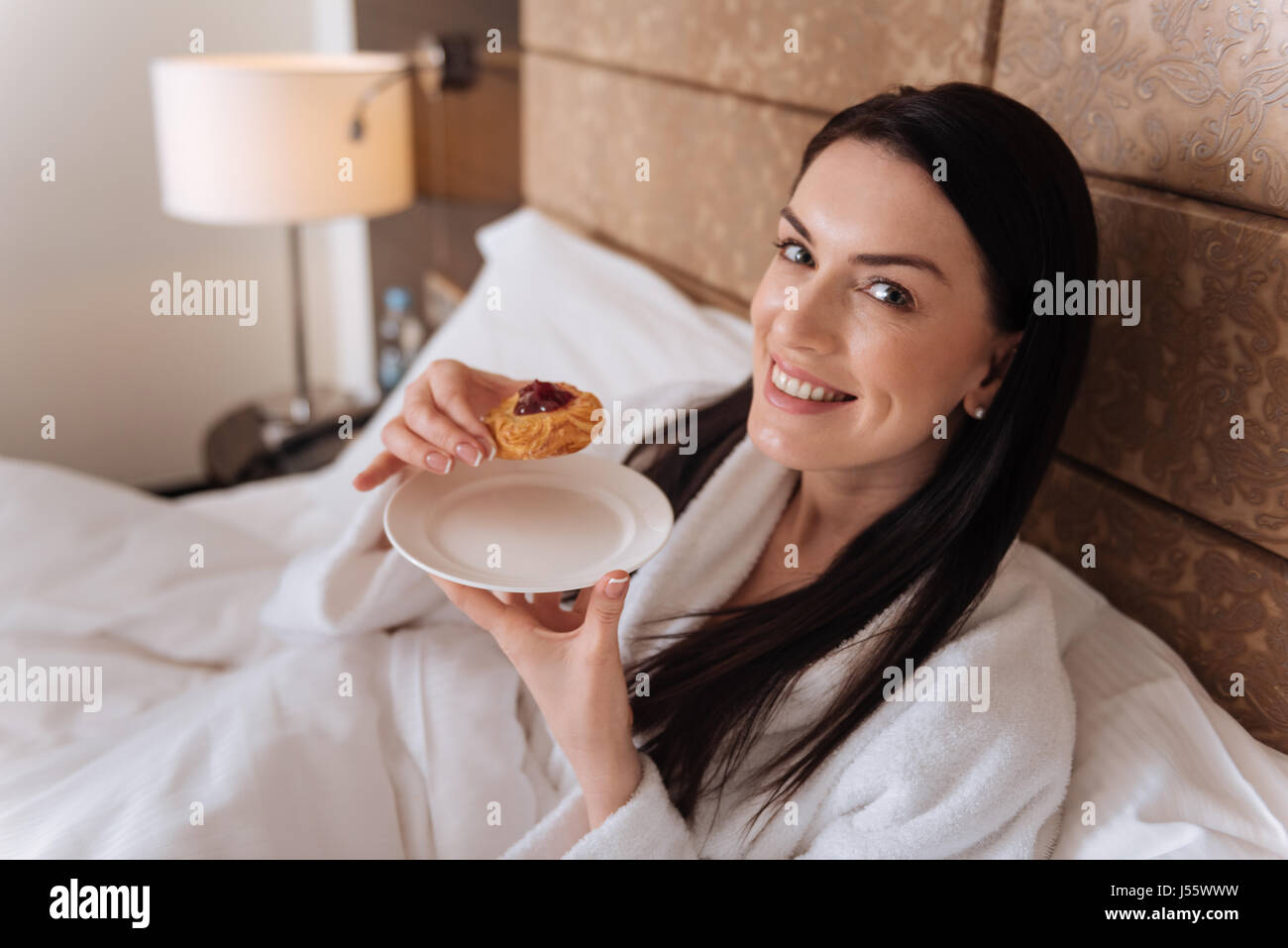 Delighted pretty woman looking at you Stock Photo - Alamy