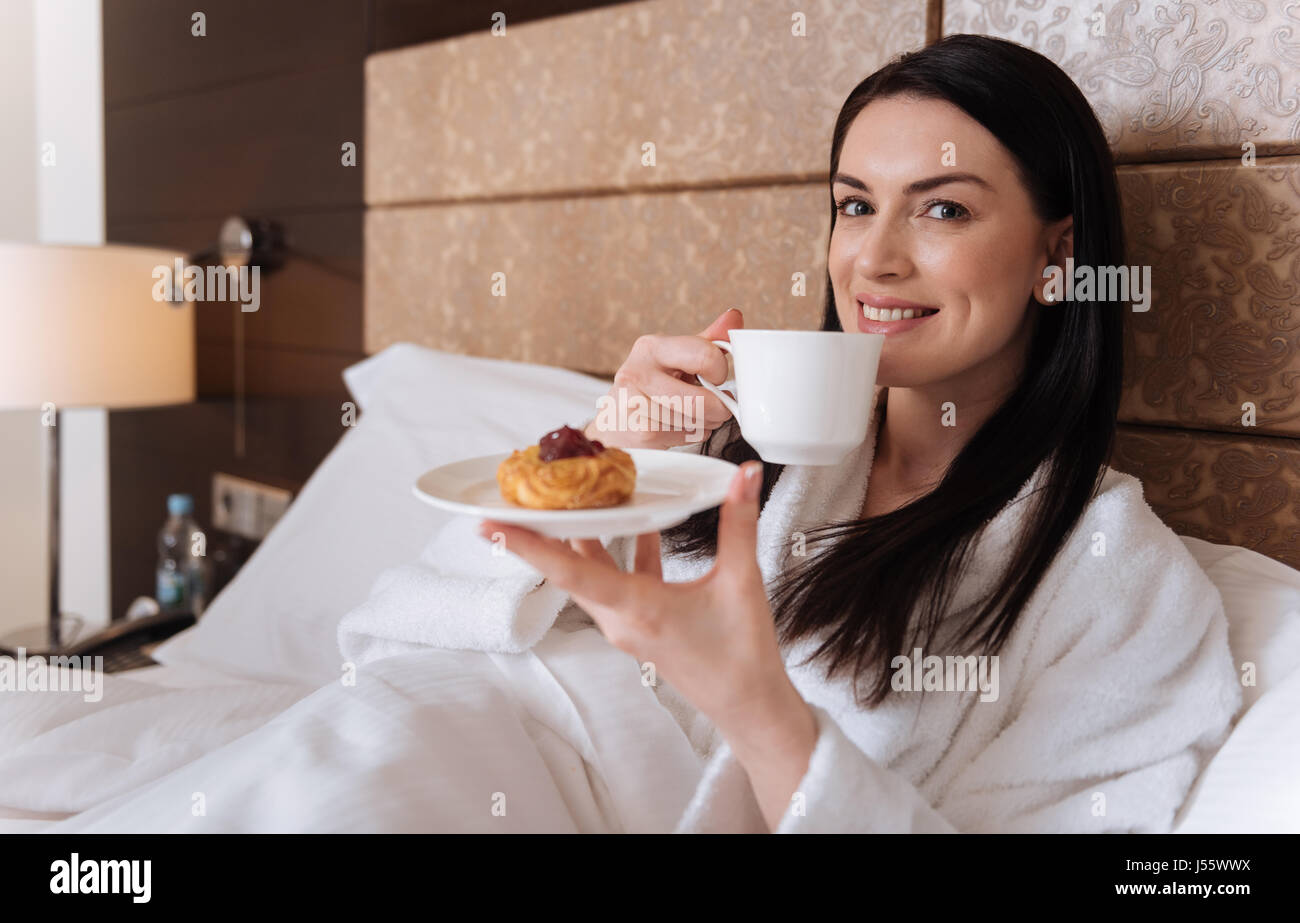 Nice positive woman enjoying her tea Stock Photo - Alamy