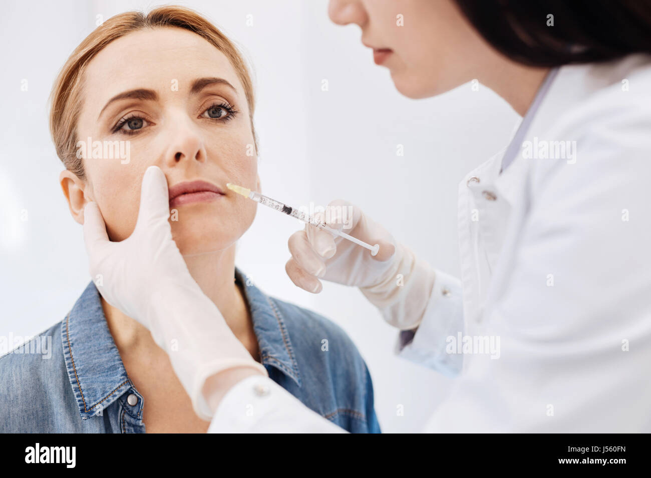 Professional female cosmetologist doing botox injections Stock Photo ...