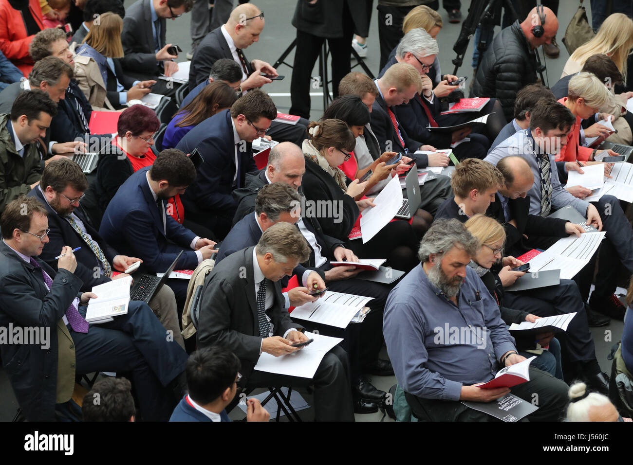 Journalists reading copies of the Labour Party's General Election ...
