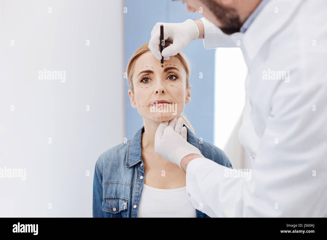 Professional male doctor preparing his patients to surgery Stock Photo ...
