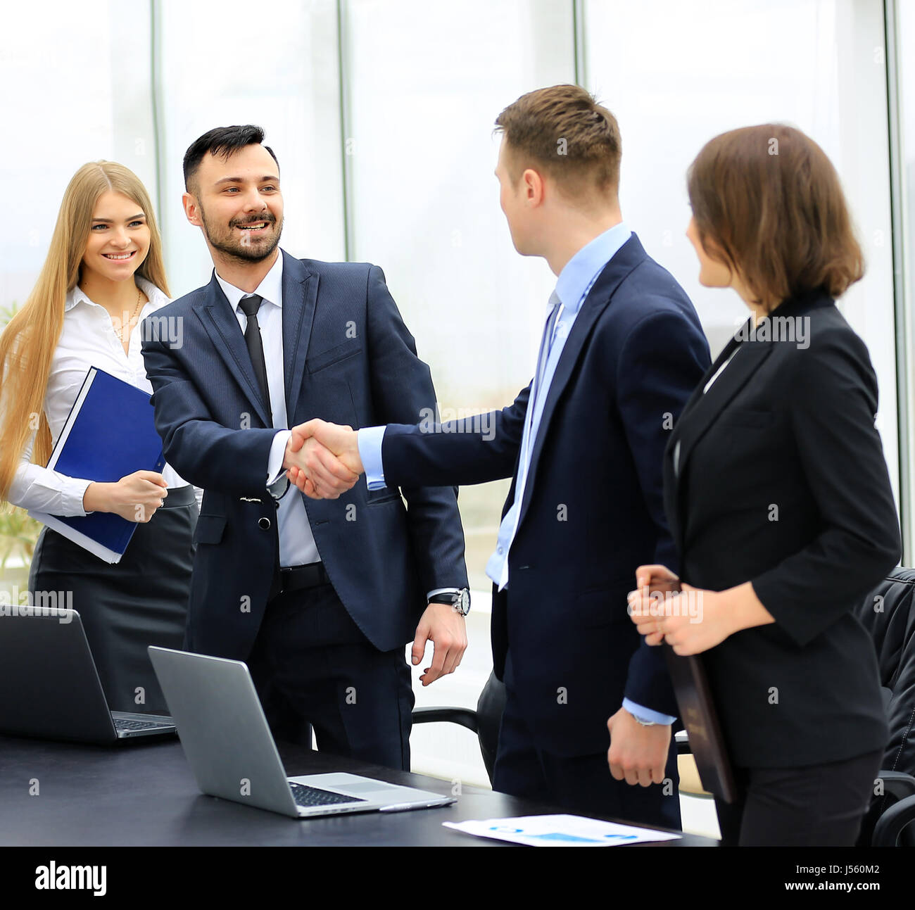 shaking hands in the office at the beginning of the working day Stock ...