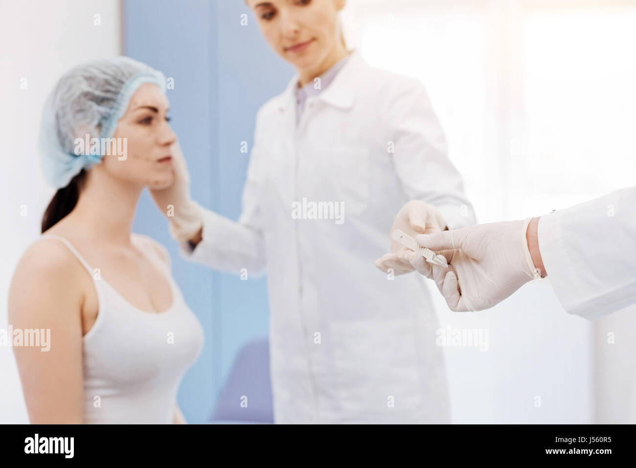 Medical tool being given to a plastic surgeon Stock Photo - Alamy