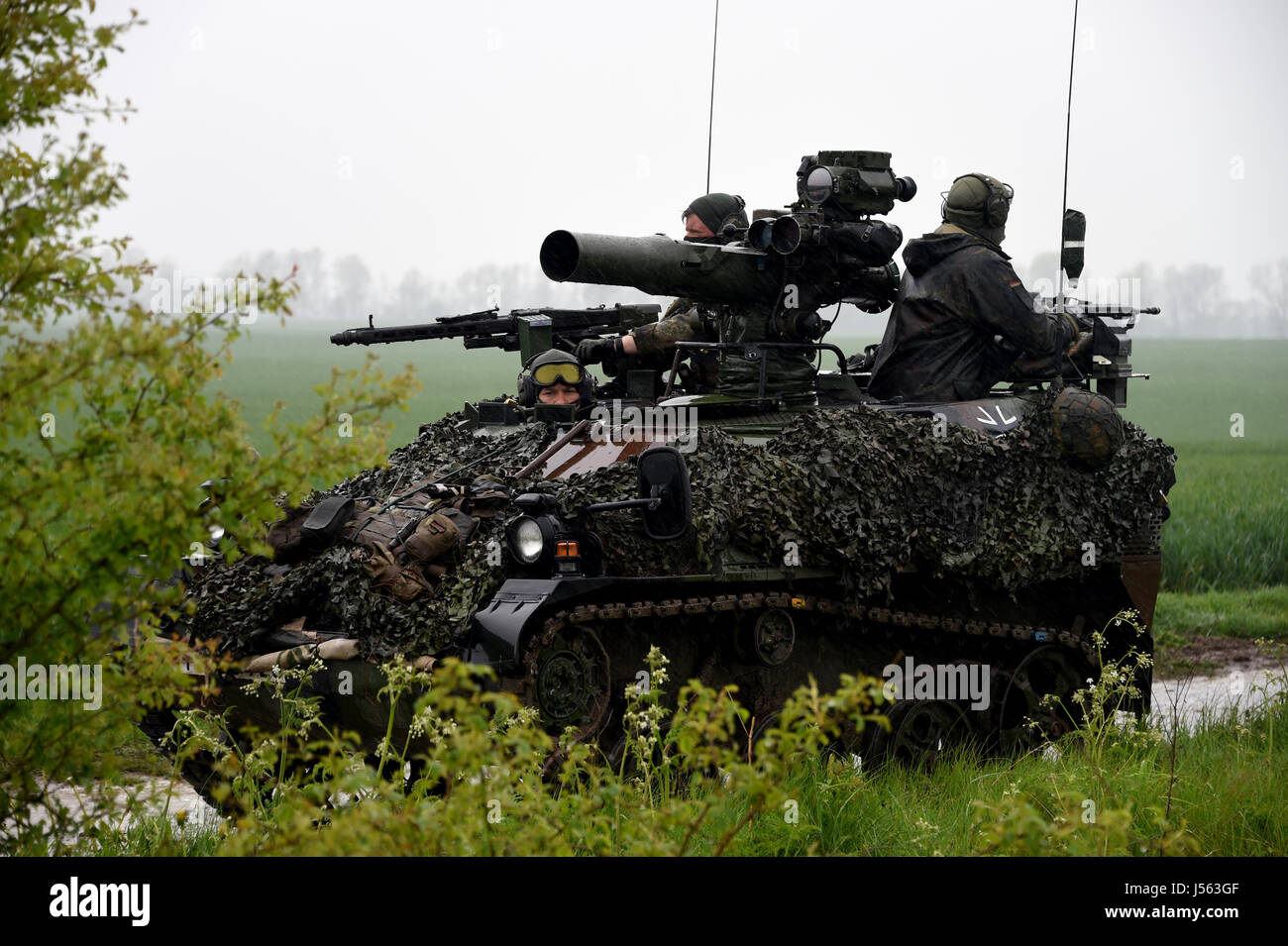 Schmoel, Germany. 16th May, 2017. A Wiesel tank carries paratroopers ...