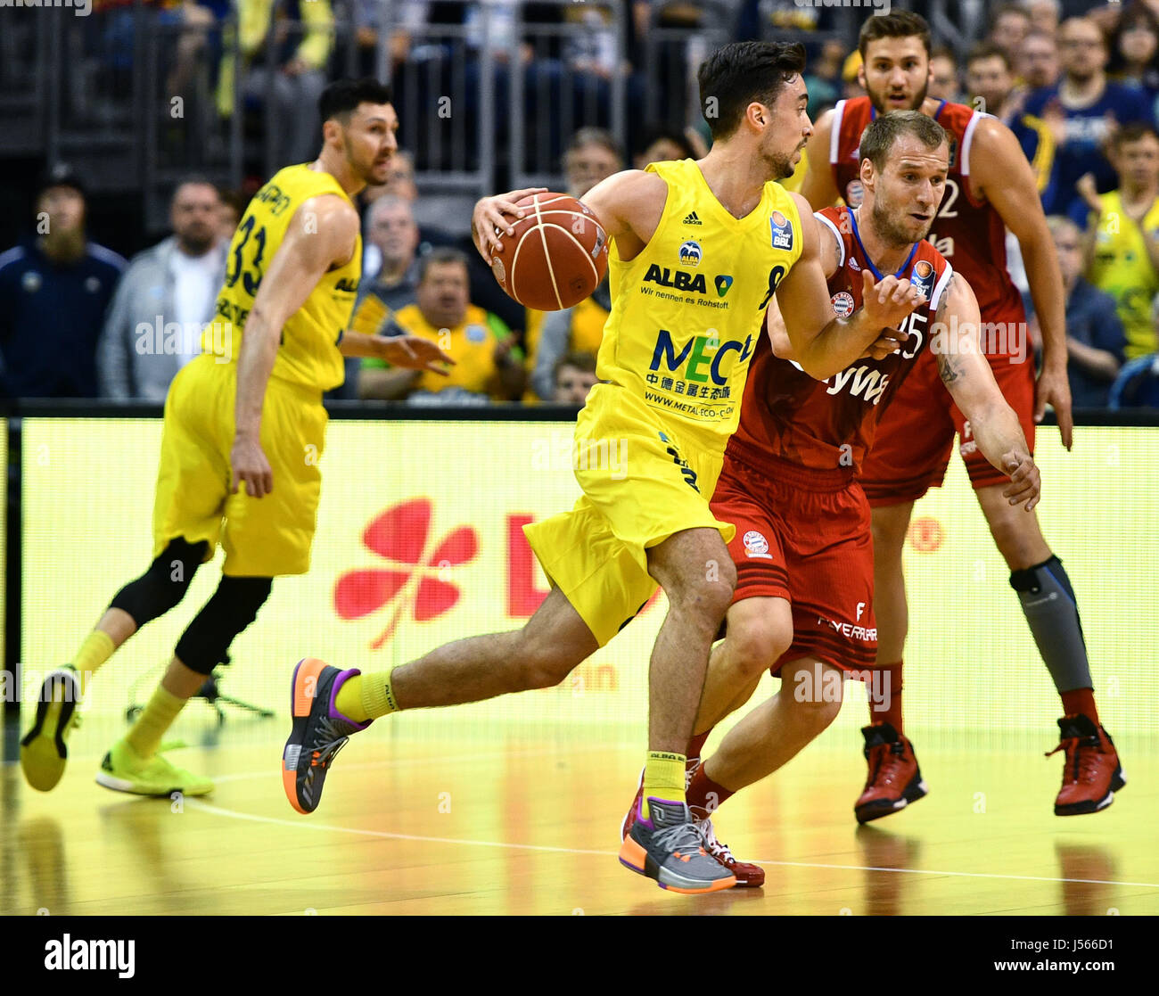 Berlin's Ismet Akpinar (front C) in action against Munich's Anton Gavel ...