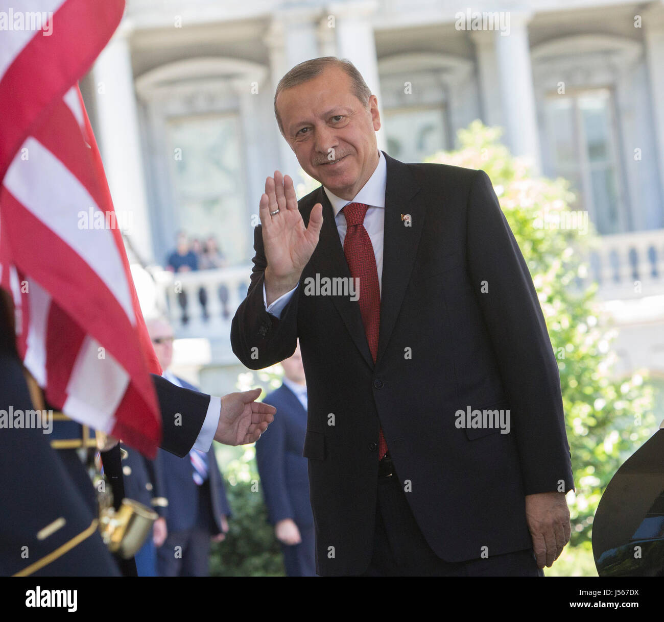 President Recep Tayyip Erdogan of Turkey waves to the press as he is ...