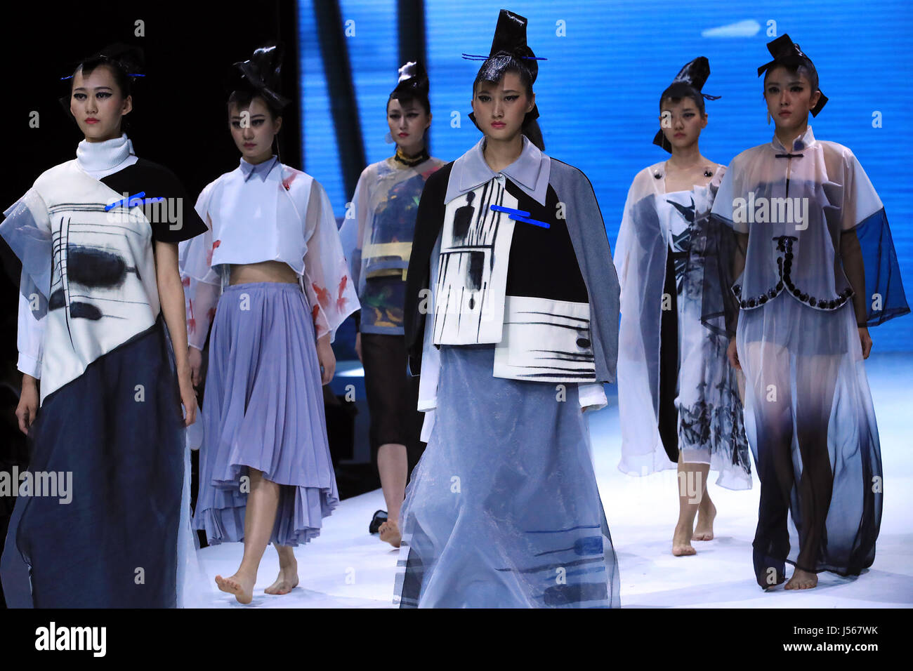 Beijing, China. 16th May, 2017. Models present creations designed by ...
