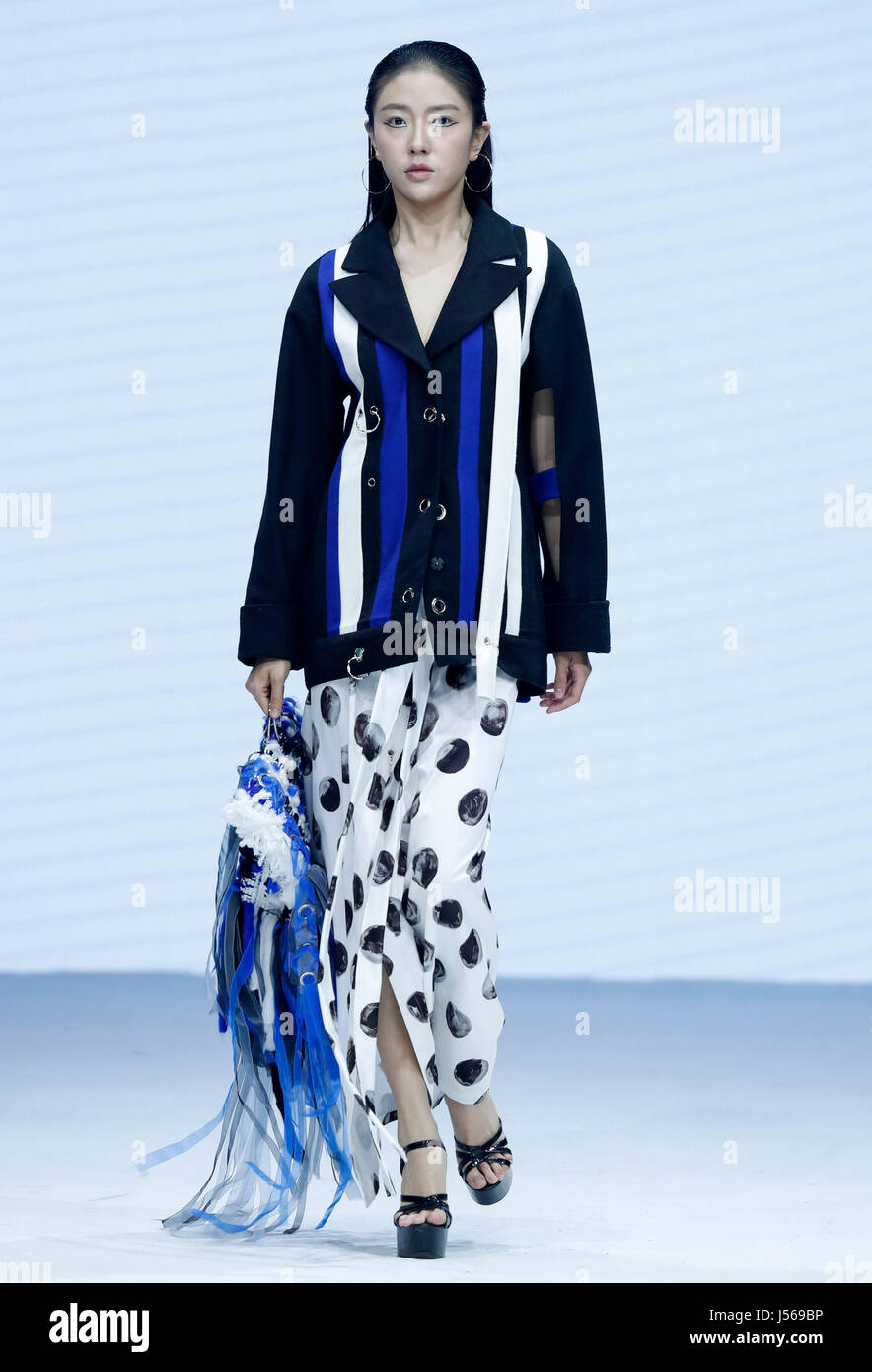 Beijing, China. 17th May, 2017. A model presents a creation designed by ...
