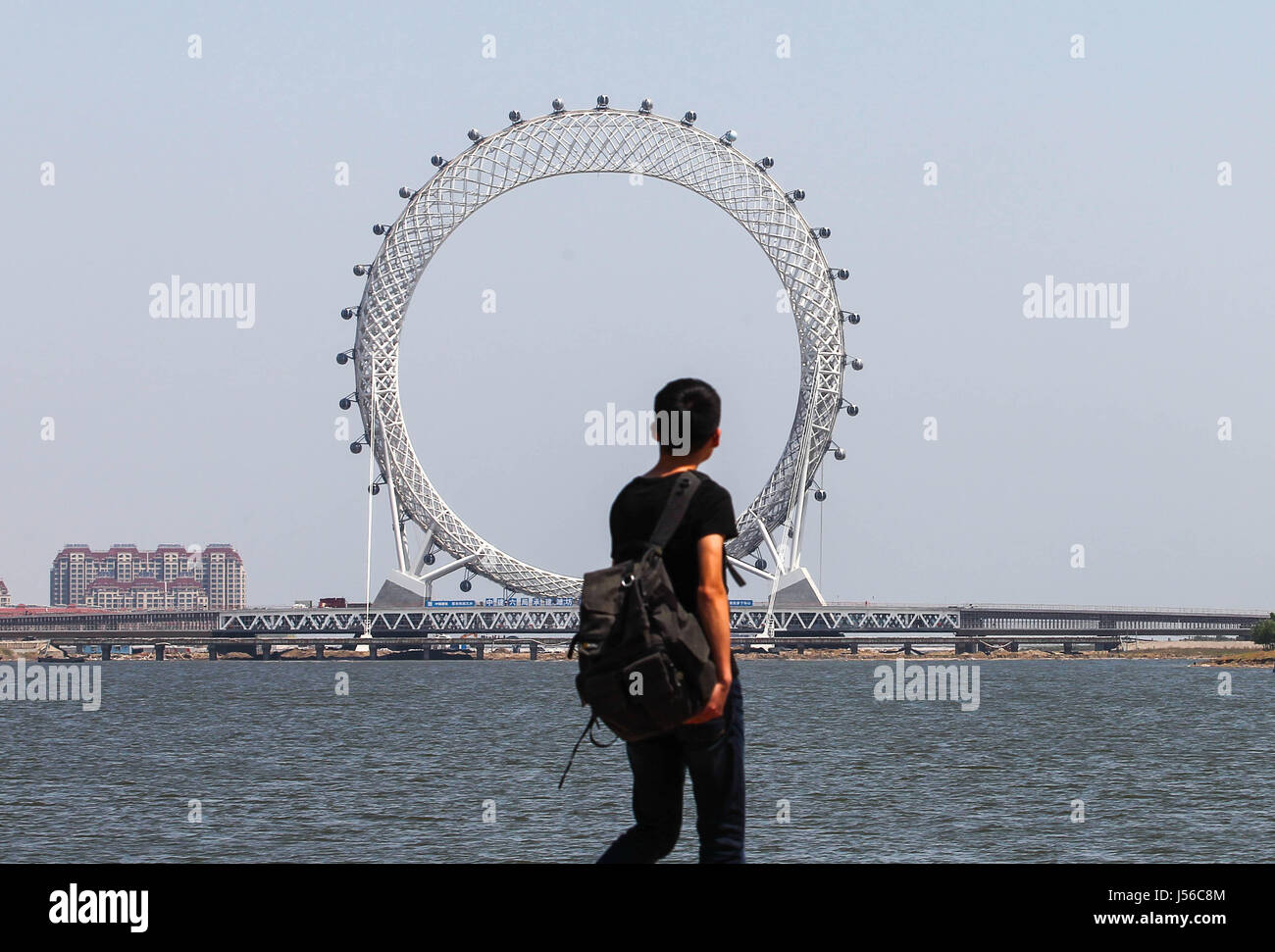 Weifang, China's Shandong Province. 17th May, 2017. A visitor watches a ...