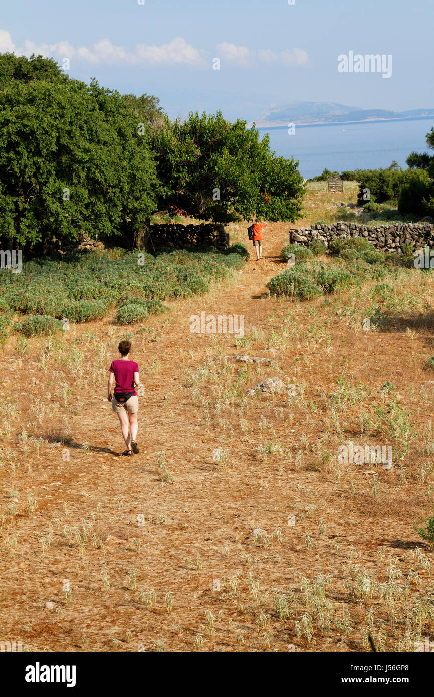 Tourist walkin on uninhabited Plavnik island, Croatia Stock Photo - Alamy