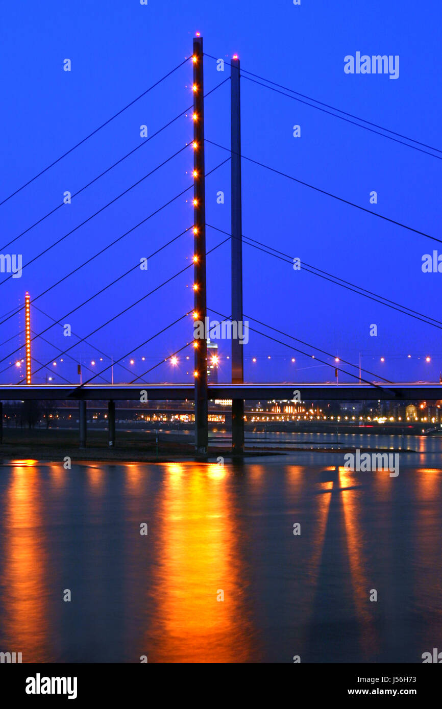 blue bridge processor bridge lighted lights in the evening water at ...