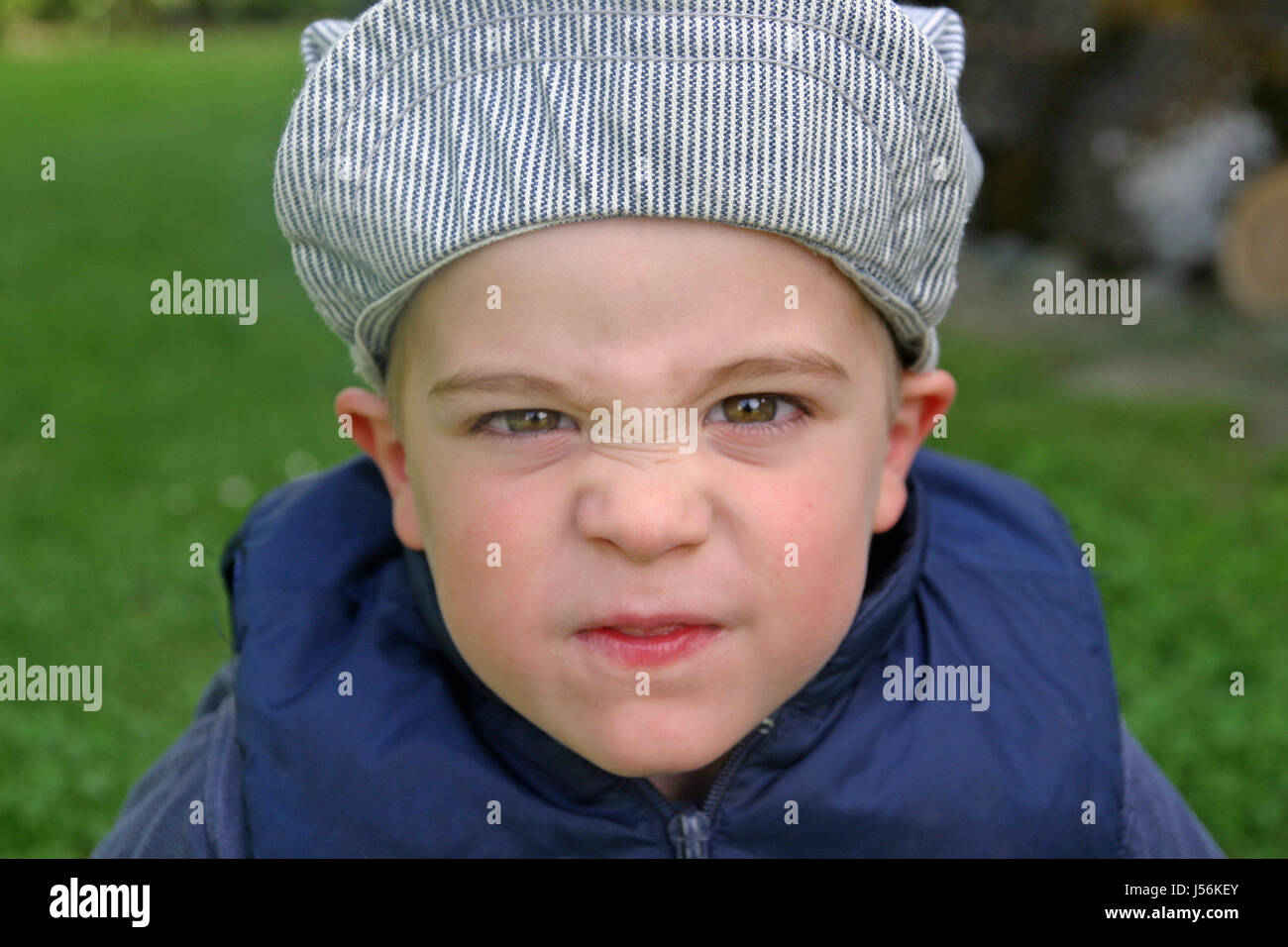portrait reluctant listless grimace rascal cute young younger child ...