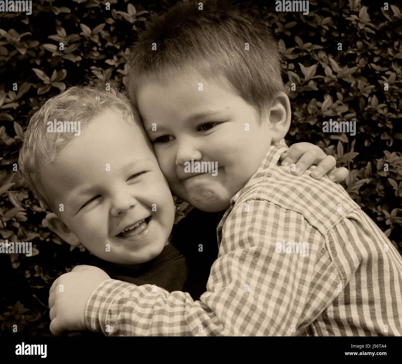 We two boys together clinging hi-res stock photography and images - Alamy