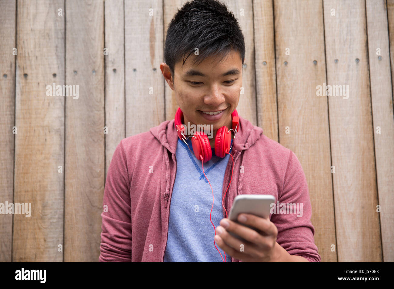 Chinese Man standing in city street using his Smart Phone Stock Photo ...