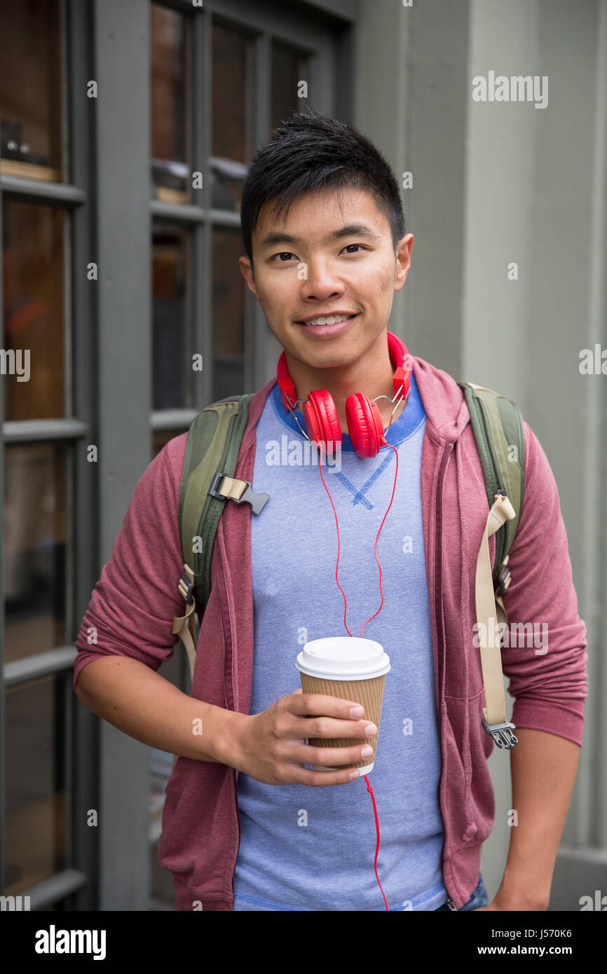 Portrait of a trendy urban Chinese man. Urban man in street Stock Photo ...