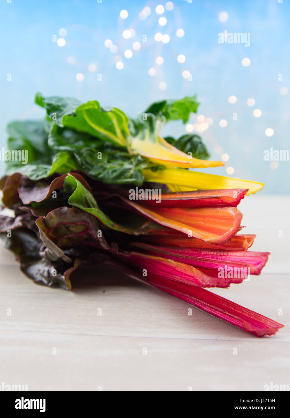 Stack of Rainbow Chard Leaves on light wooden table top Stock Photo - Alamy