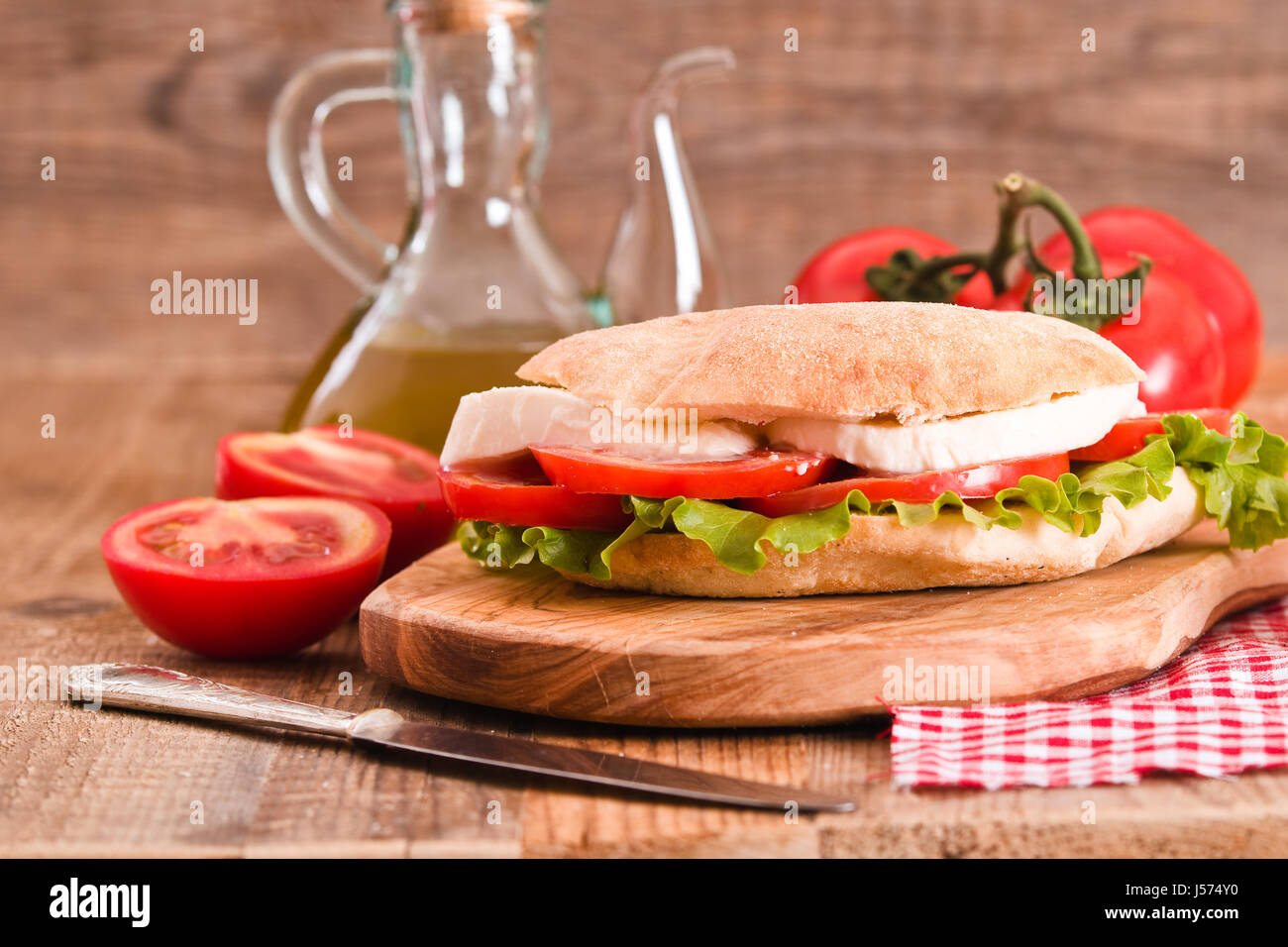 Puccia bread with mozzarella and tomato Stock Photo - Alamy