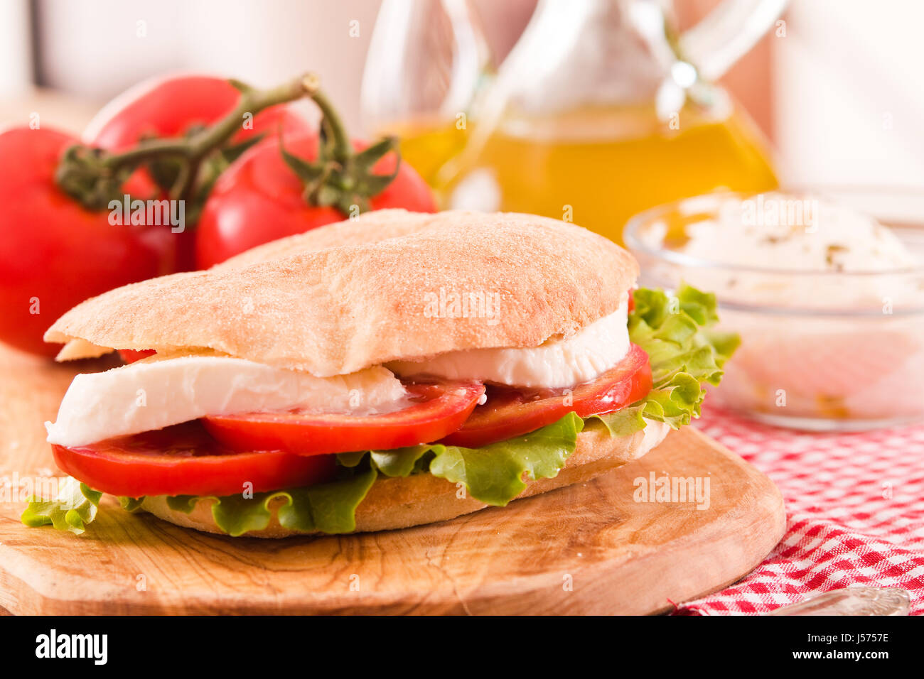 Puccia bread with mozzarella and tomato Stock Photo - Alamy