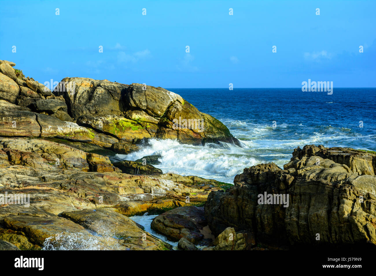 Waves washing ashore over the rocks Stock Photo - Alamy