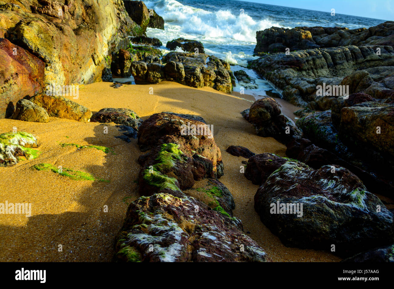 Waves washing ashore over the rocks Stock Photo - Alamy
