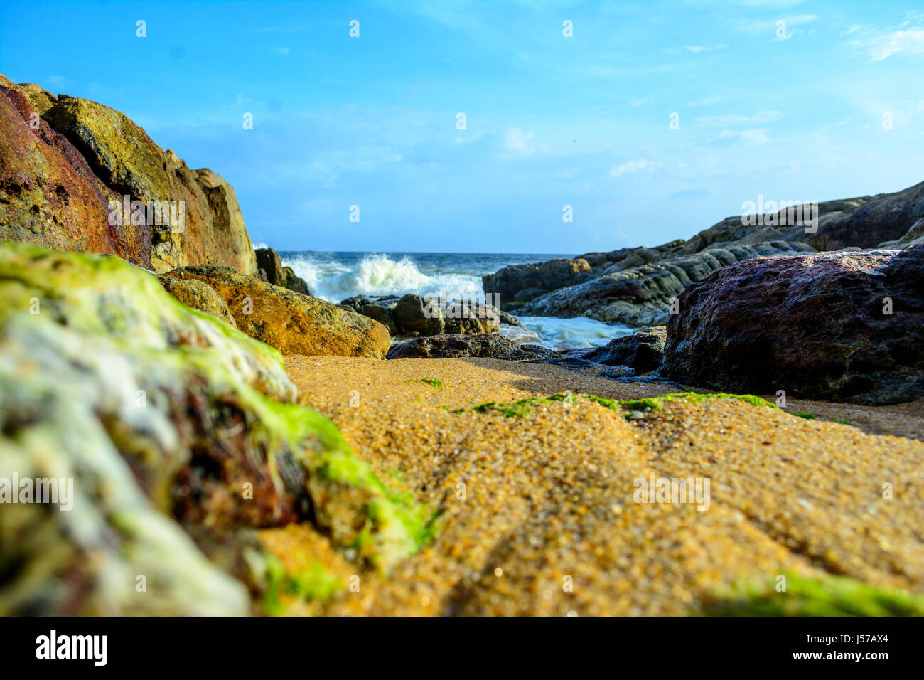 Waves washing over rocks, Indian Ocean Stock Photo - Alamy