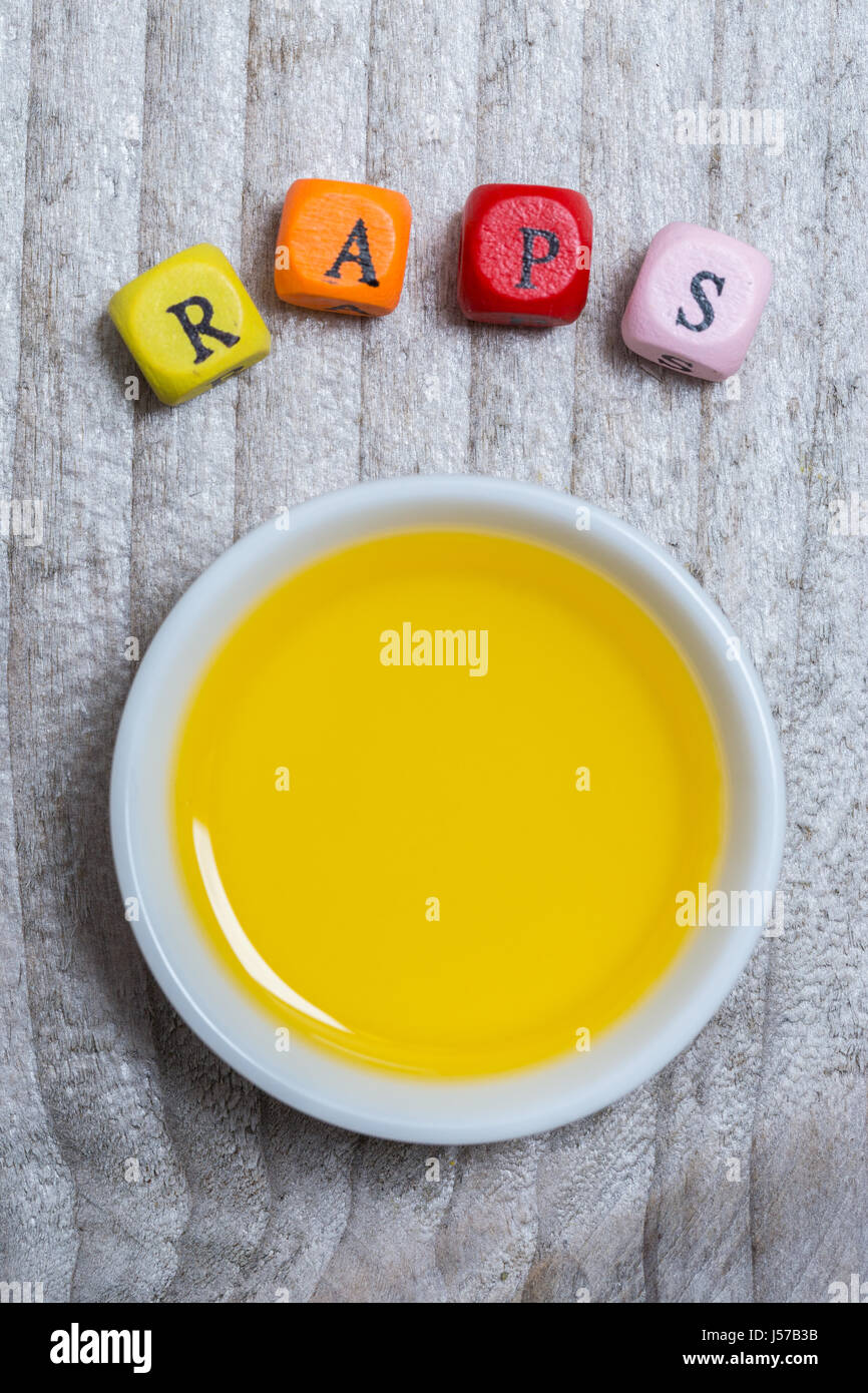 Raps (in german canola) with oil concept on gray wood Stock Photo - Alamy