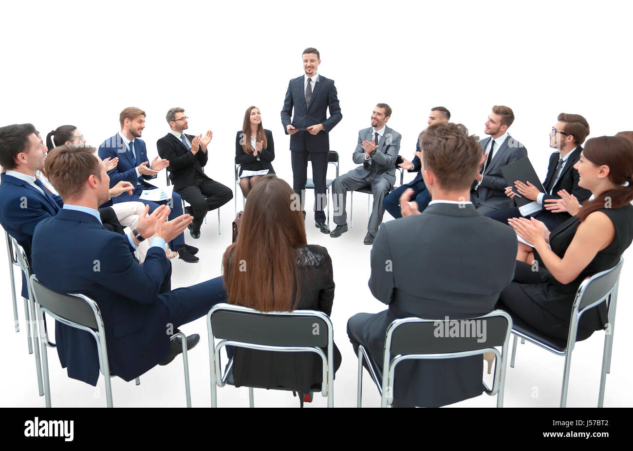 Business group greets leader with clapping and smiling Stock Photo - Alamy