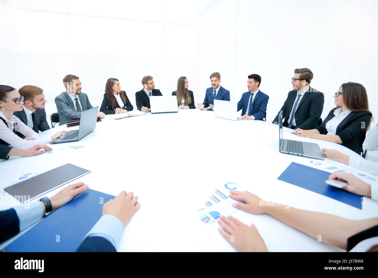 Business team, sitting at athe round table on white background Stock ...
