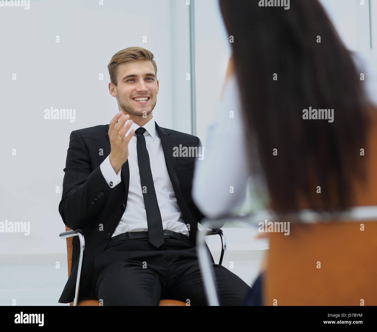 Young manager listening to his colleague explanations Stock Photo - Alamy