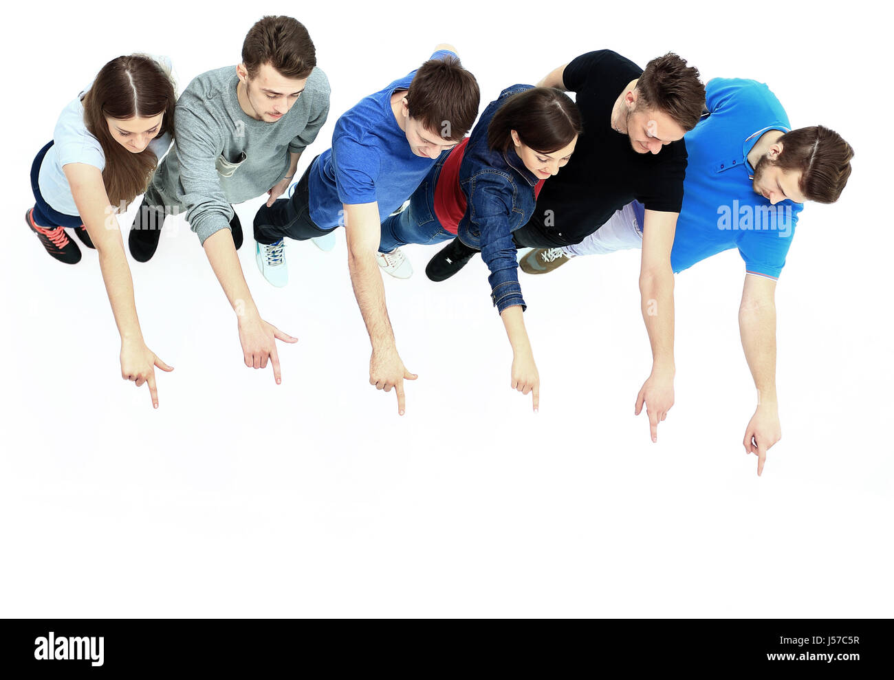group of young people pointing at something Stock Photo - Alamy