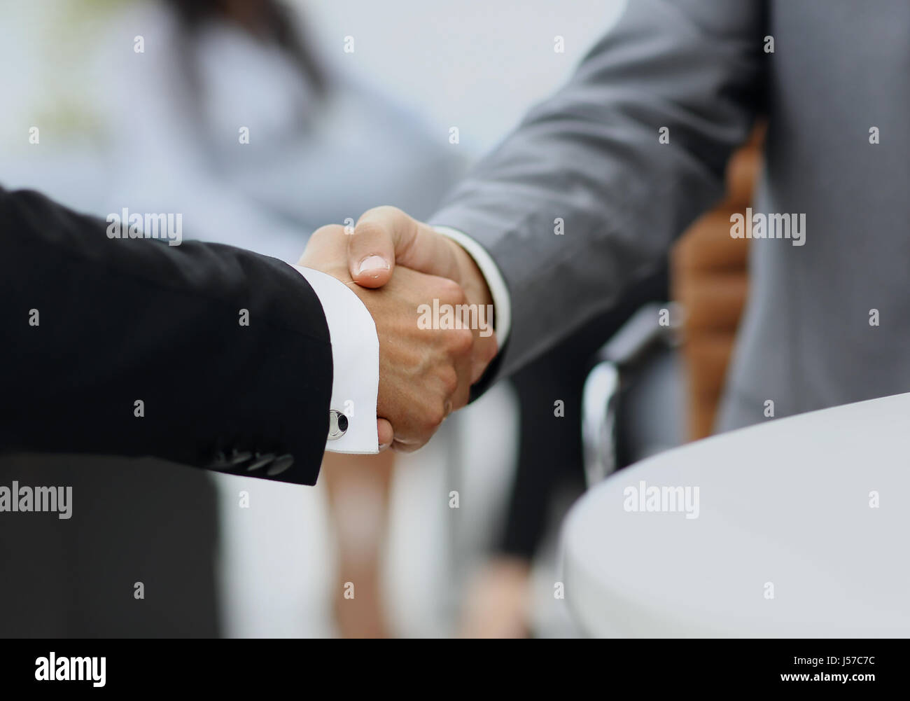Men shaking hands professional over document hi-res stock photography ...