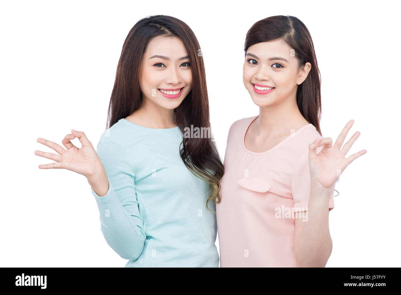 Two happy young female friends. Asian girls laughing Stock Photo - Alamy