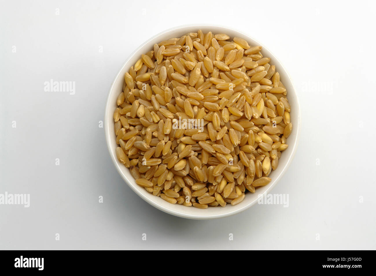 Cup of wheat isolated on white Stock Photo - Alamy