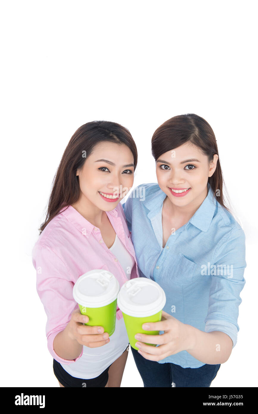 Two charming woman friends enjoying coffee Stock Photo - Alamy