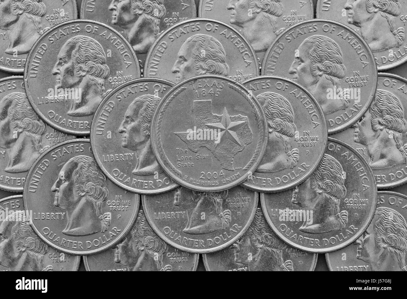 Texas State and coins of USA. Pile of the US quarter coins with George ...
