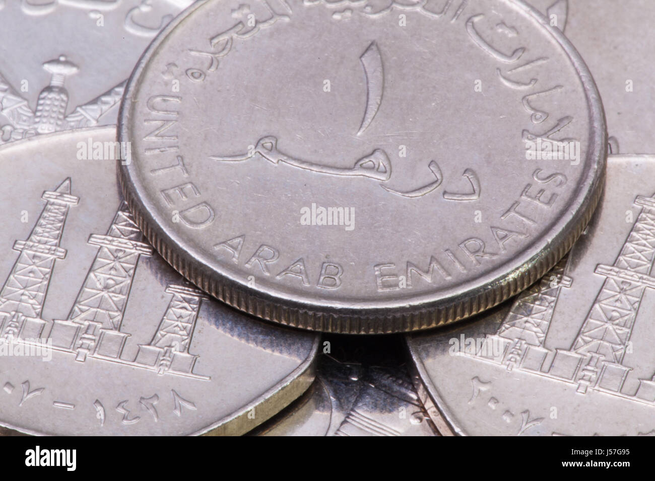Detail of different United Arab Emirates Dirhams coins on the table ...