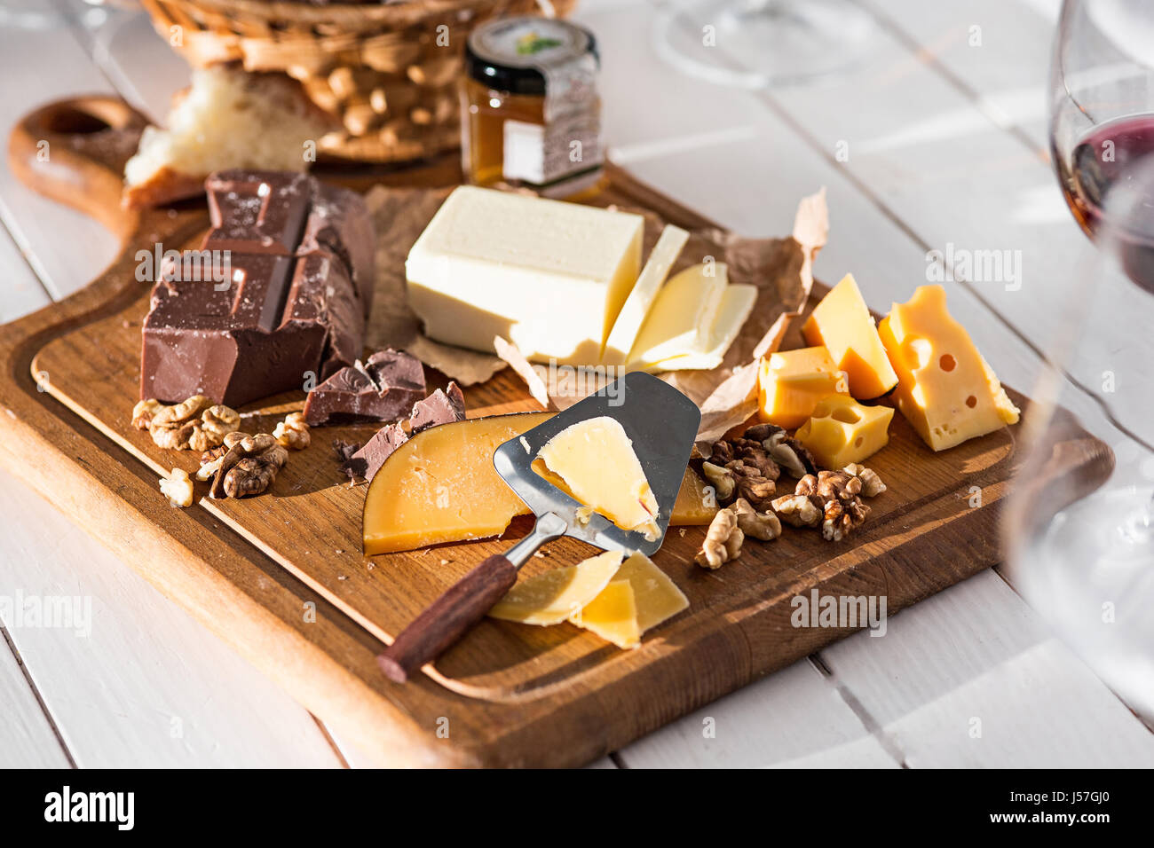 The different kind of cheese and walnuts on wooden background Stock ...