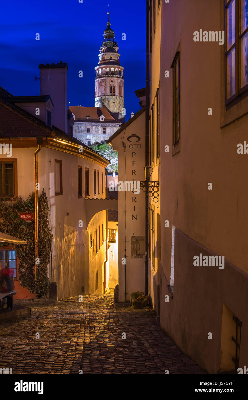 Czesky Krumlov old town street view with the Castle Tower at nighttime ...