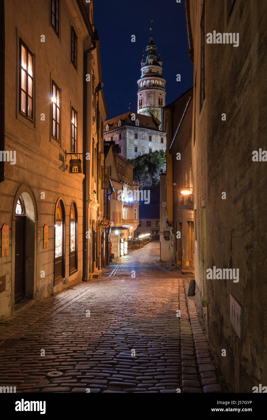 Czesky Krumlov old town street view with the Castle Tower at nighttime ...