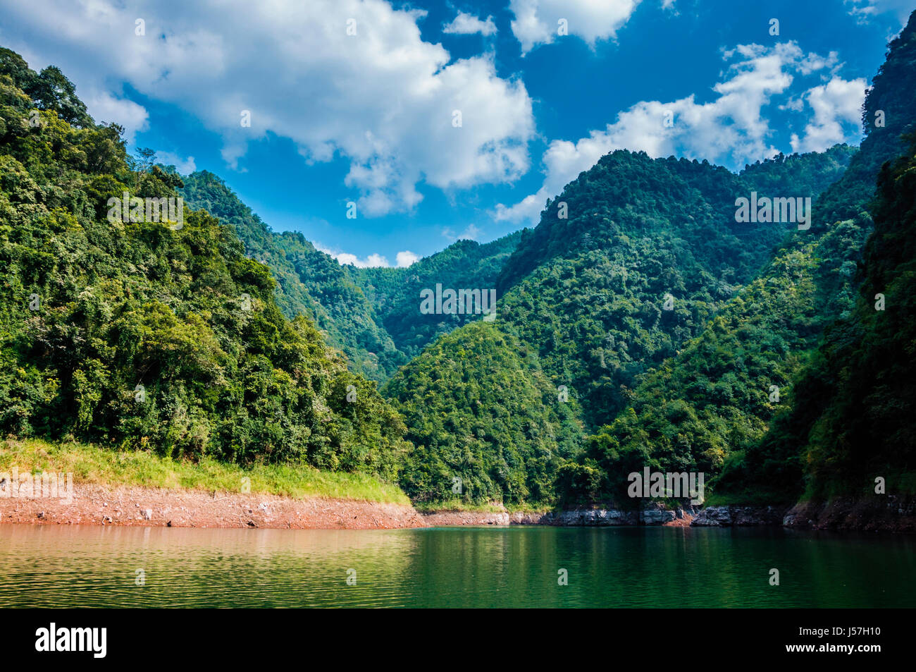 Beautiful reservoir scenery with blue sky in summer Stock Photo - Alamy