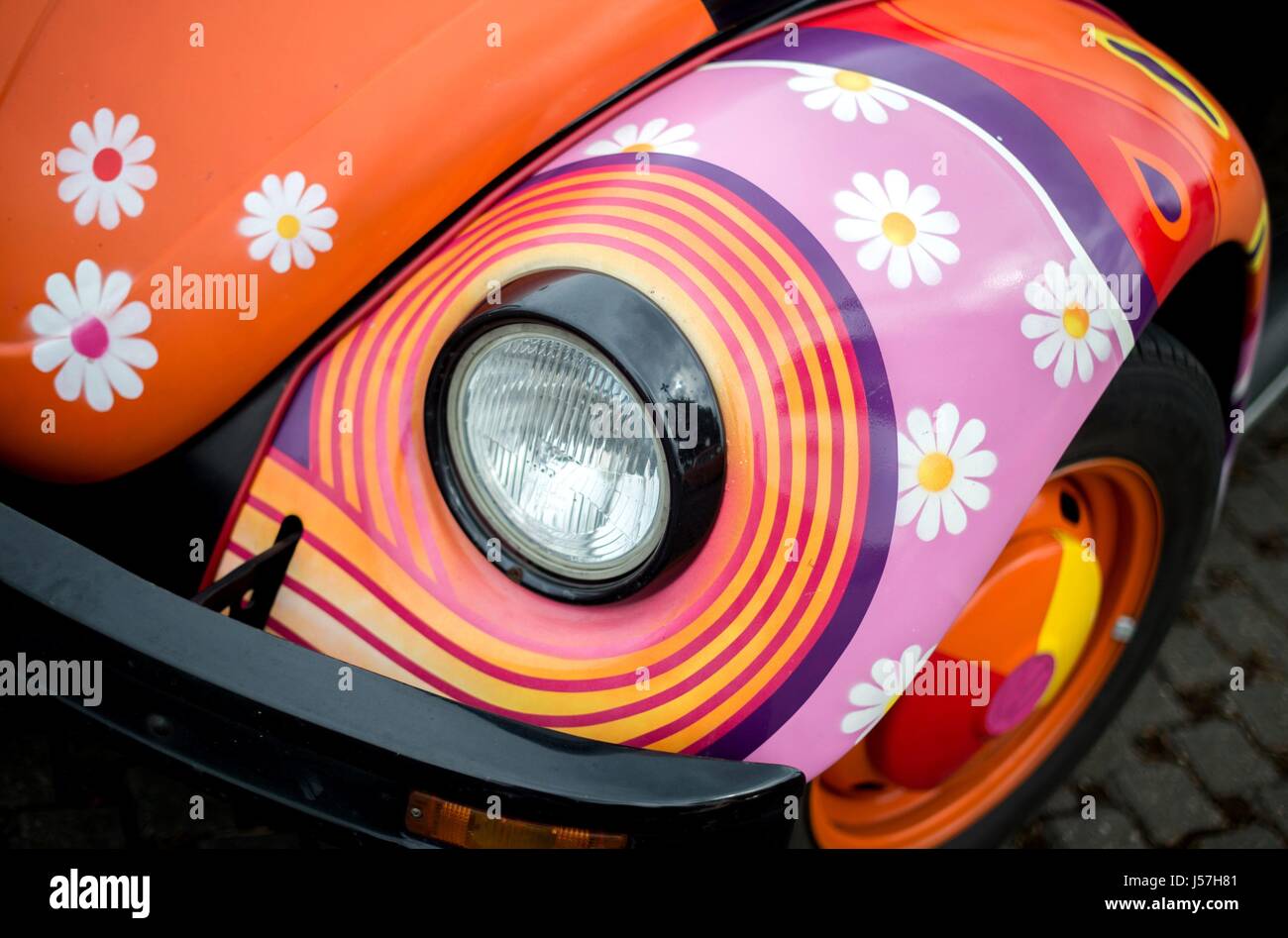 A VW Beetle with flowers on it parks at the Maikaefertreffen (May ...