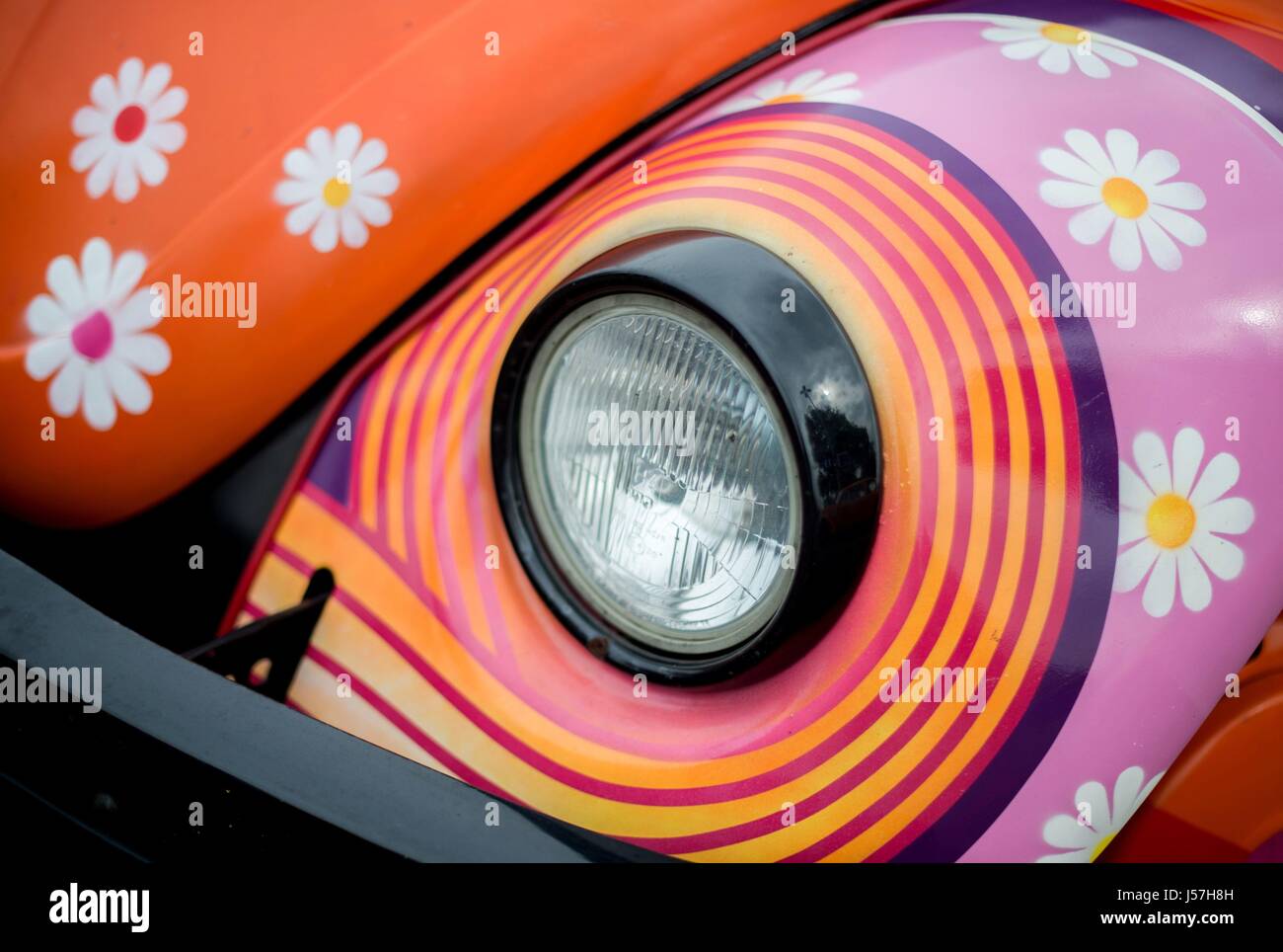 A VW Beetle with flowers on it parks at the Maikaefertreffen (May ...