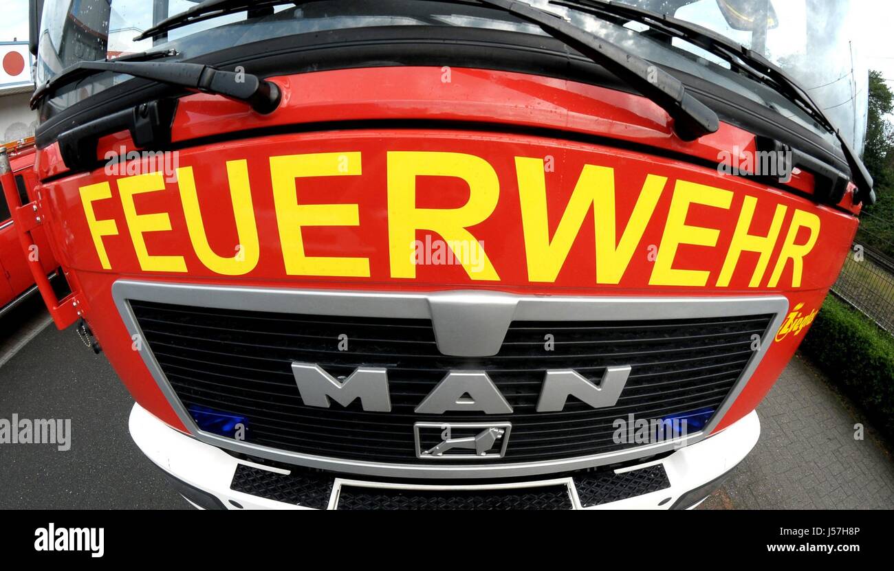 A fire fighting vehicle with the inscription "Feuerwehr" on it in ...