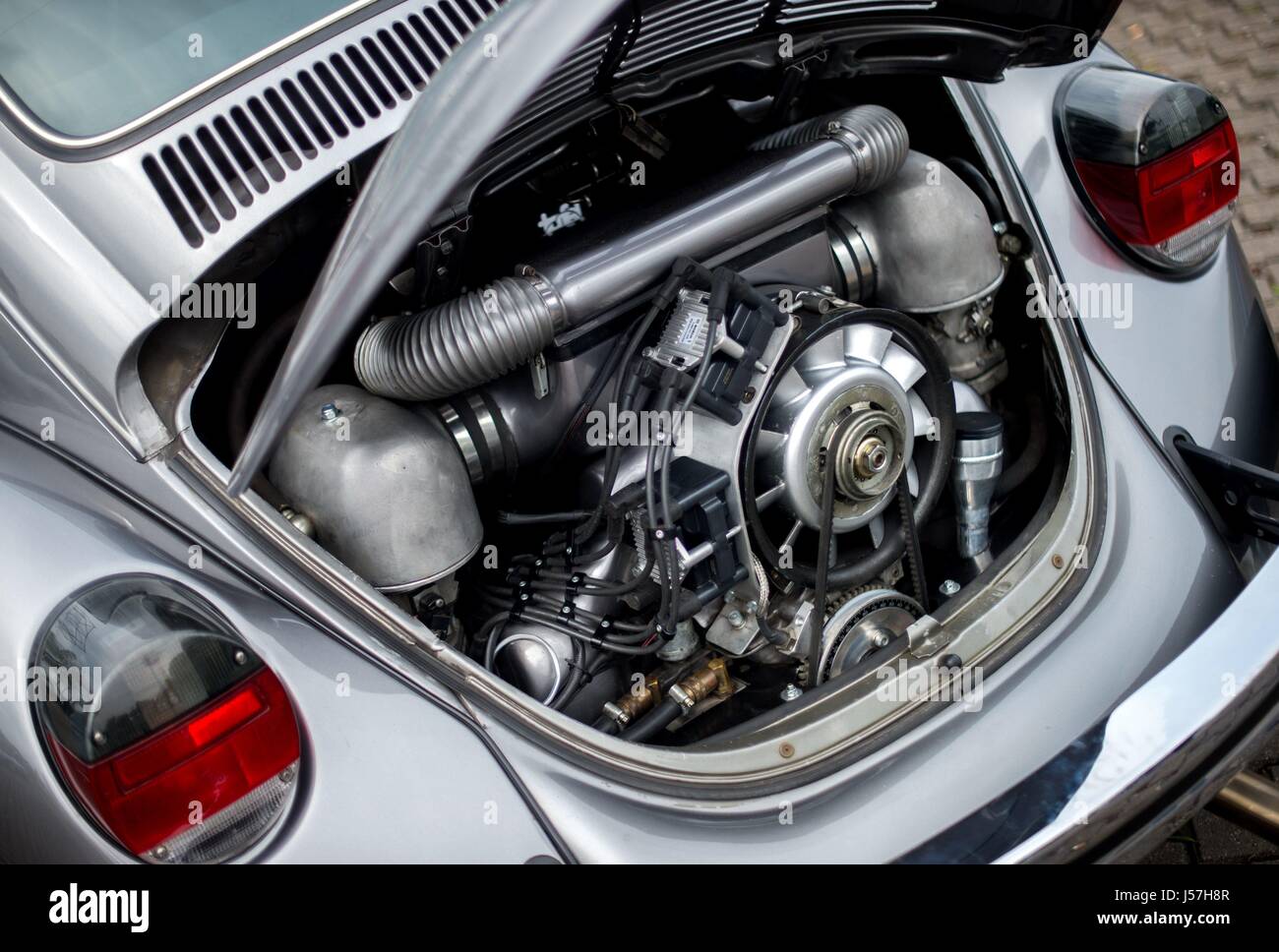 The engine compartment of a VW Beetle is open at the Maikaefertreffen ...