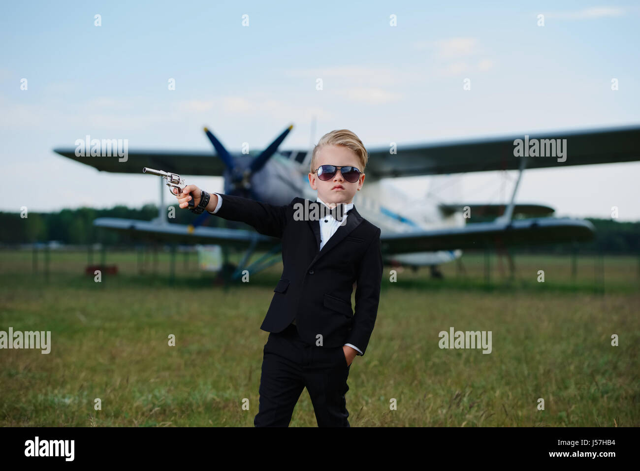photo of little boy playing secret agent Stock Photo - Alamy