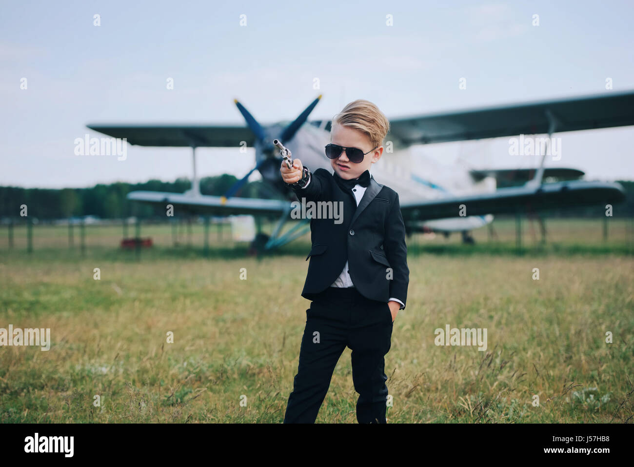 photo of little boy playing secret agent Stock Photo - Alamy